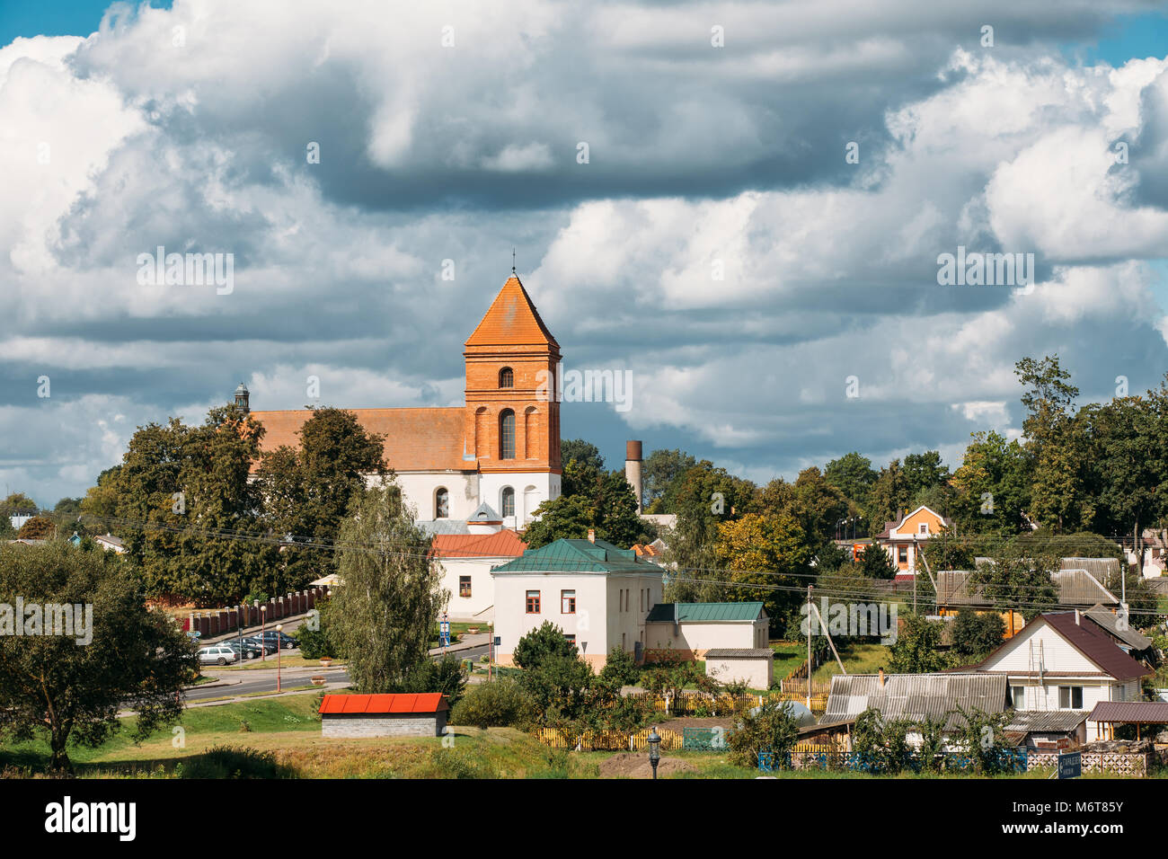 Mir, Belarus. Landscape Of Village Houses And Saint Nicolas Roman ...