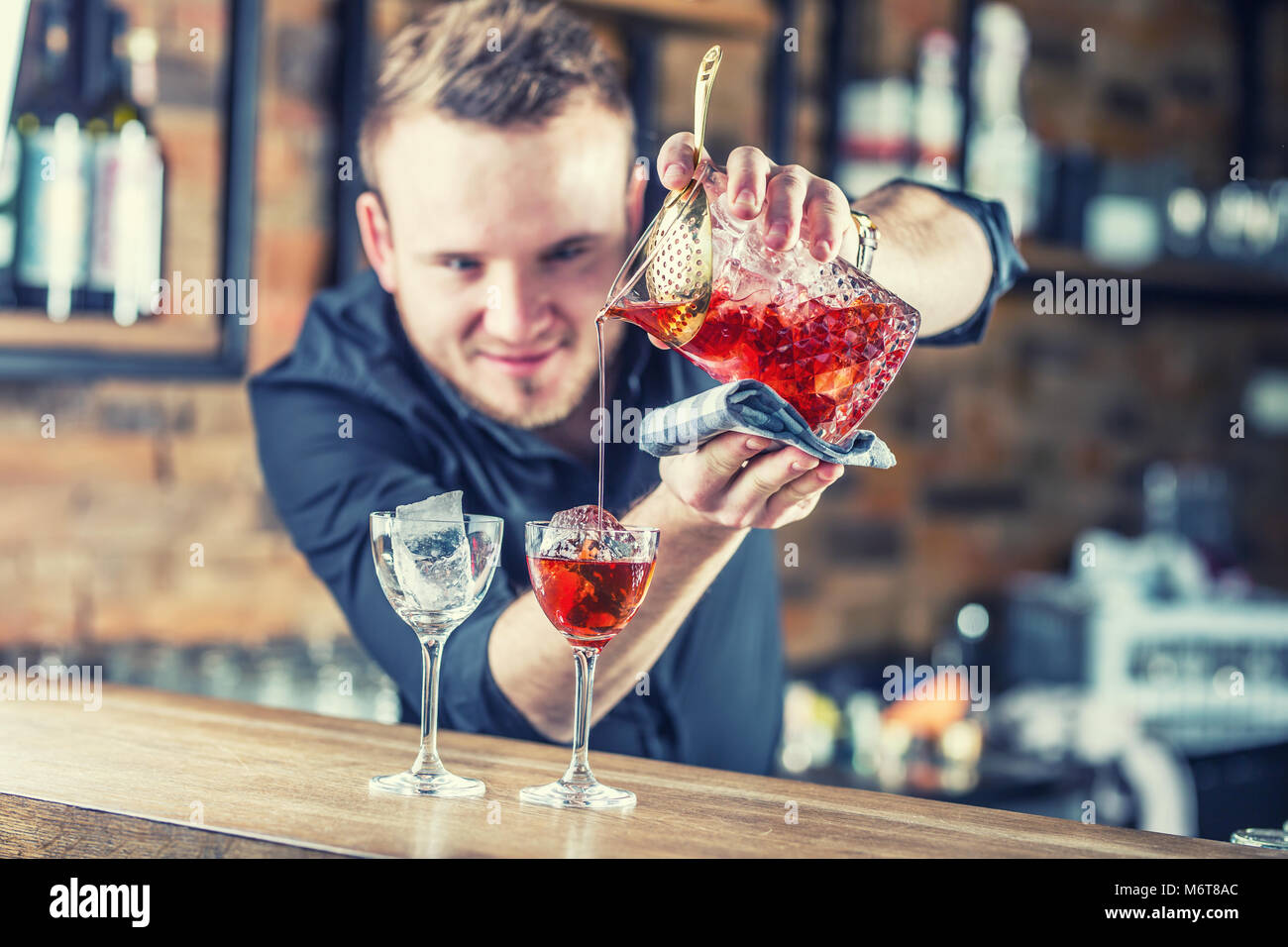 Bartender pouring cocktail hi-res stock photography and images - Alamy