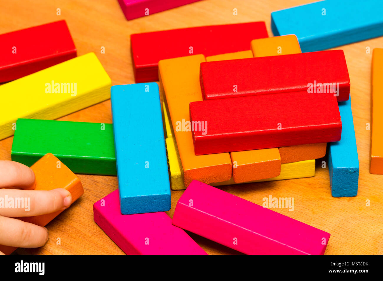 Scattered heap of toy colored wooden bricks Stock Photo - Alamy