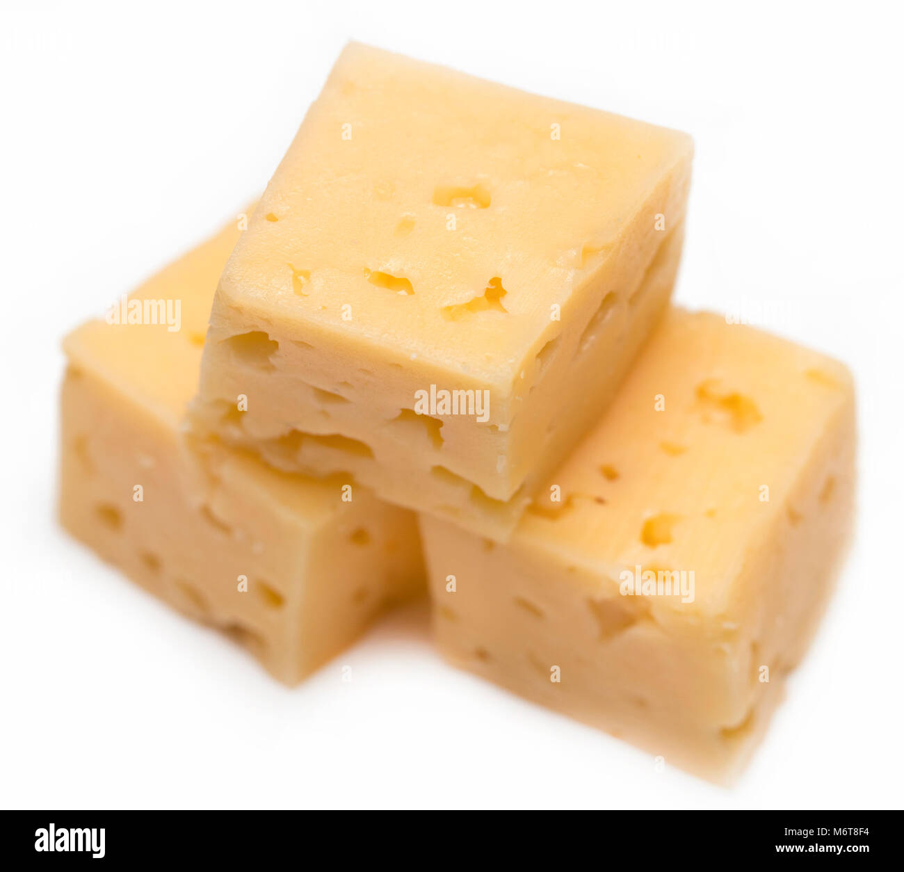 Cube of cheese isolated on a white background Stock Photo - Alamy