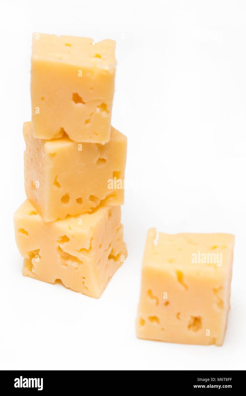 Cube of cheese isolated on a white background Stock Photo - Alamy