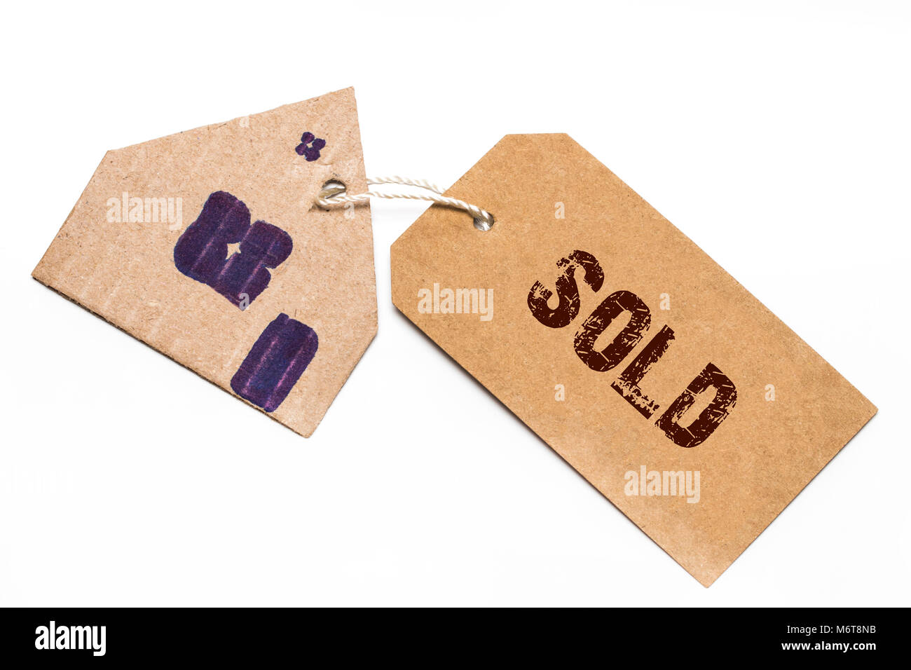 House with sold tag isolated on white background Stock Photo - Alamy
