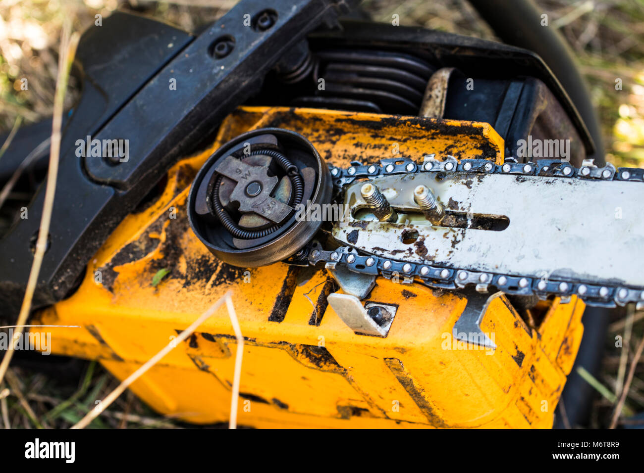 Repair of chainsaws. Old saw broke down on the job Stock Photo - Alamy