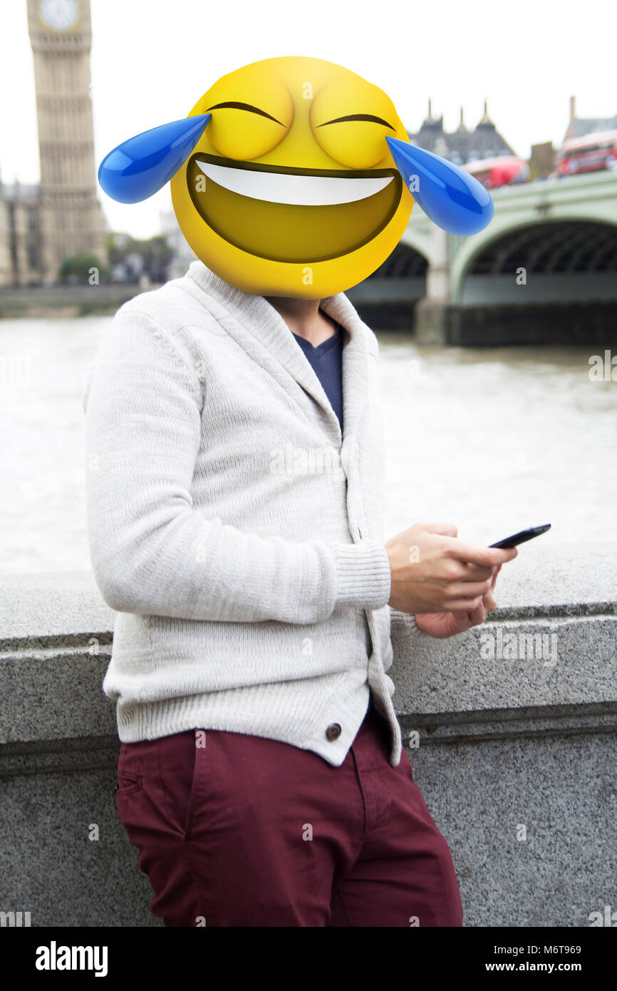 man with emoji head laughing Stock Photo - Alamy