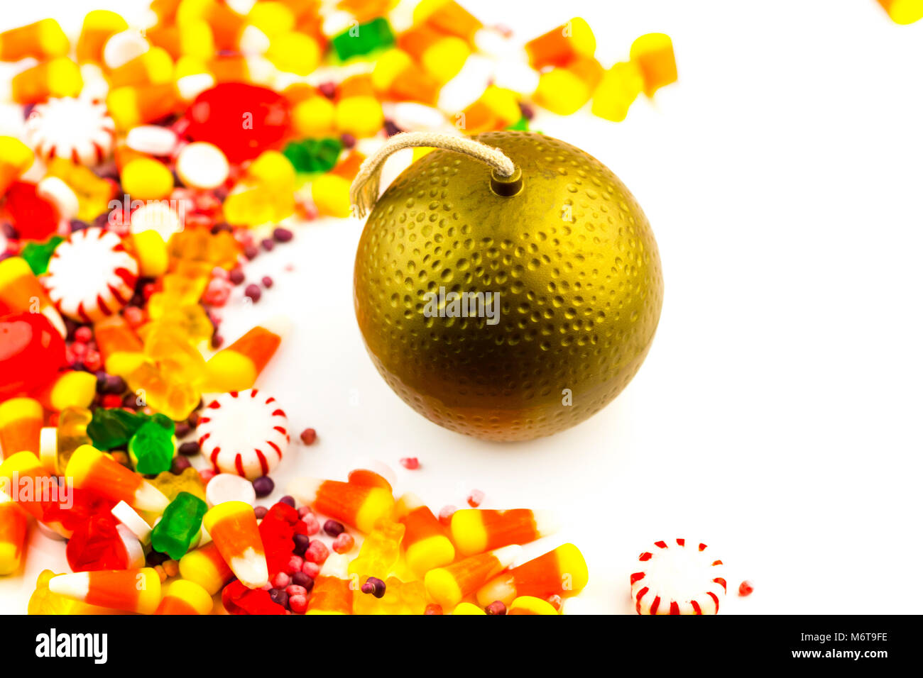 Colorful candy and toy bomb on a white background. The concept of ...