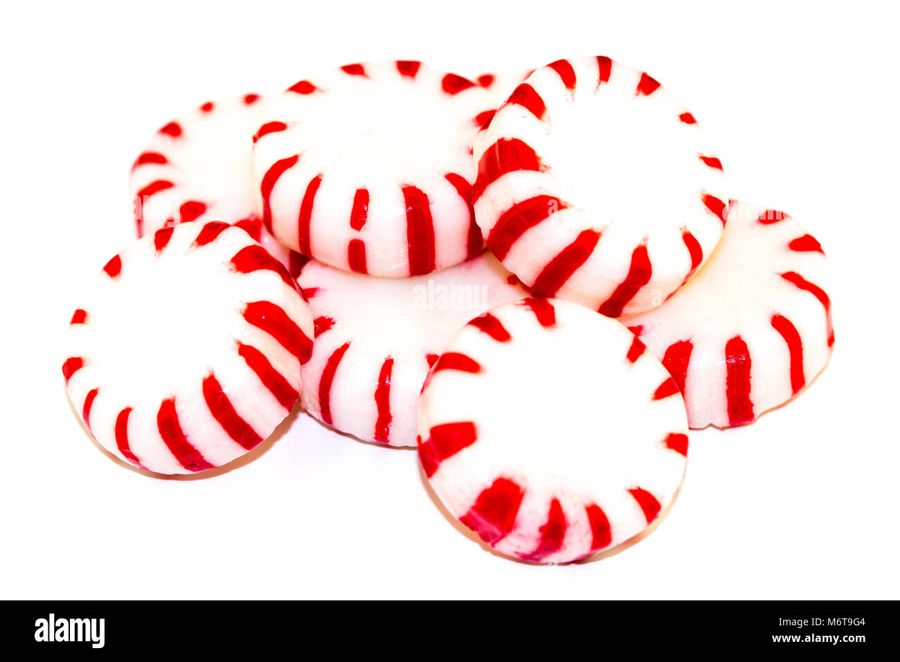 Red peppermint candy on a white background Stock Photo - Alamy