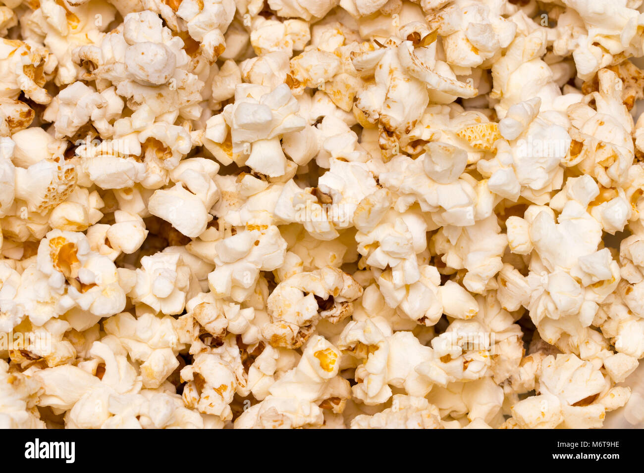 Scattered salted popcorn, texture background. Close up.The view from ...