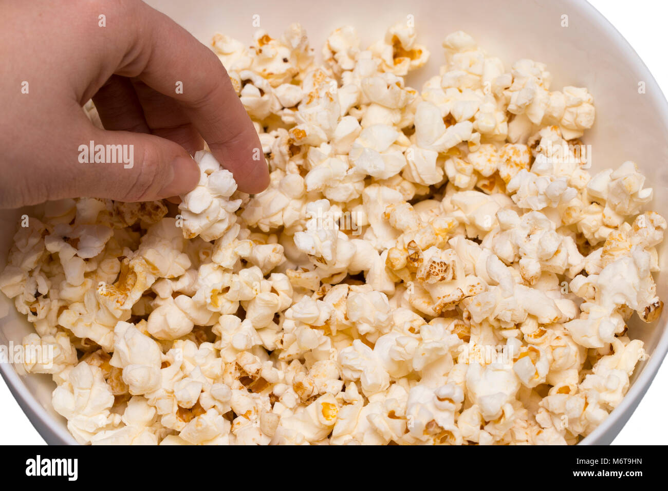 Popcorn viewed from above on blue background. Woman eating popcorn ...