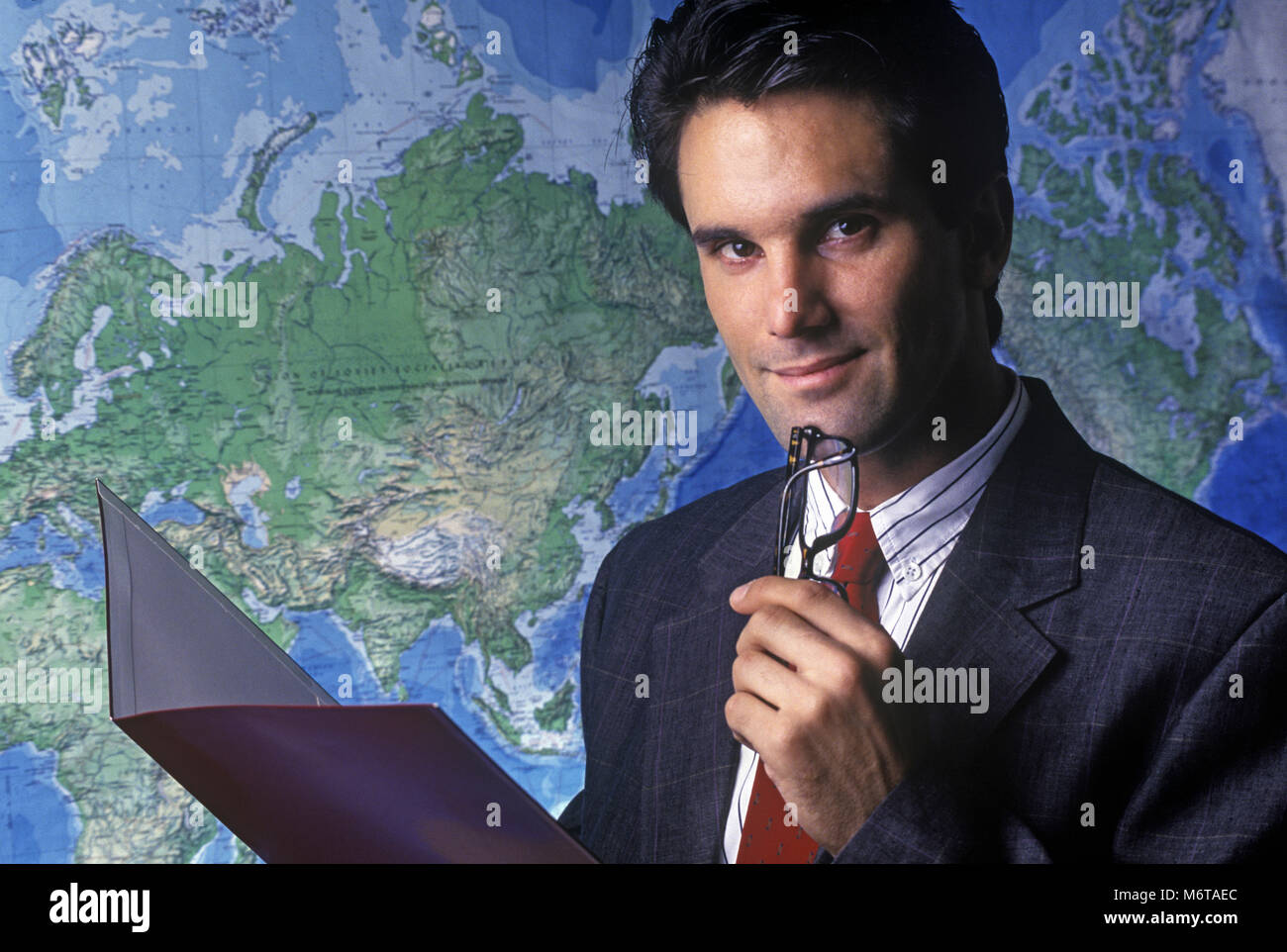 1990 HISTORICAL CAUCASIAN BUSINESS MAN WITH SOVIET ERA WORLD MAP (©RAND ...