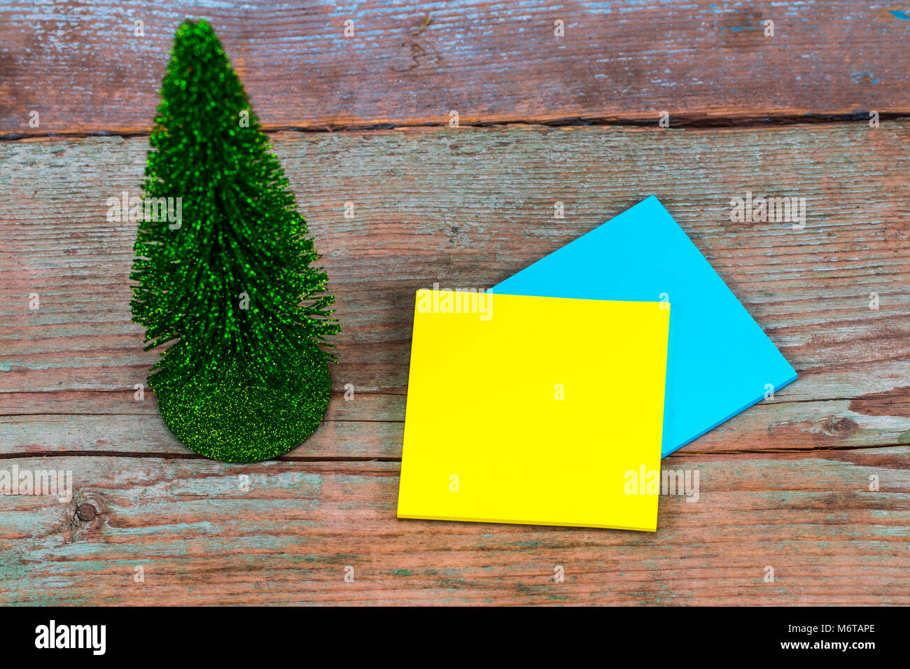 sticky note with empty space for a text and Christmas tree on wooden ...