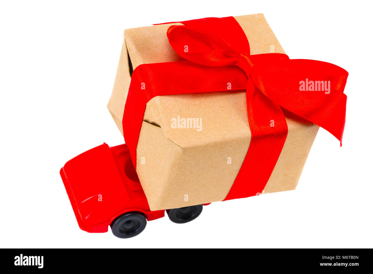 Red toy car delivering gifts box on a white background Stock Photo - Alamy