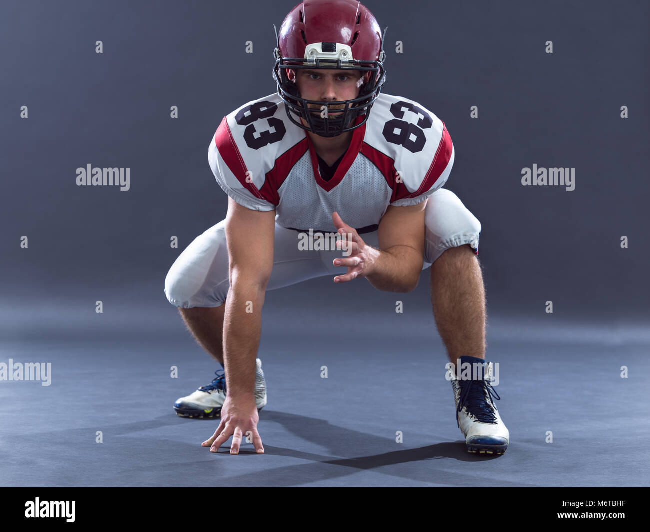 American football player getting ready before starting the game while ...