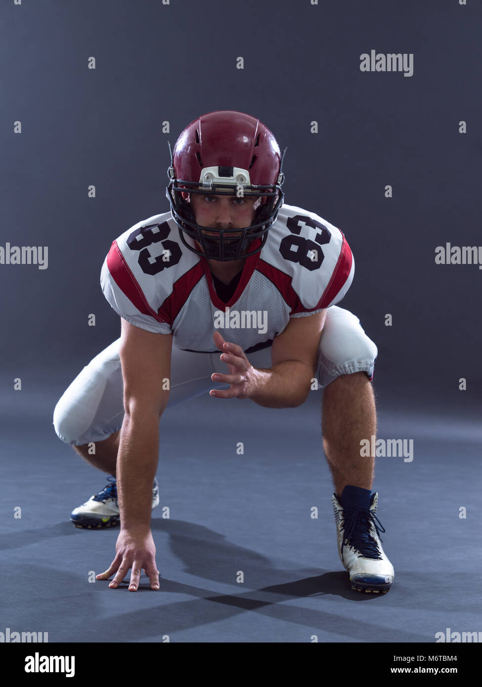 American football player getting ready before starting the game while ...