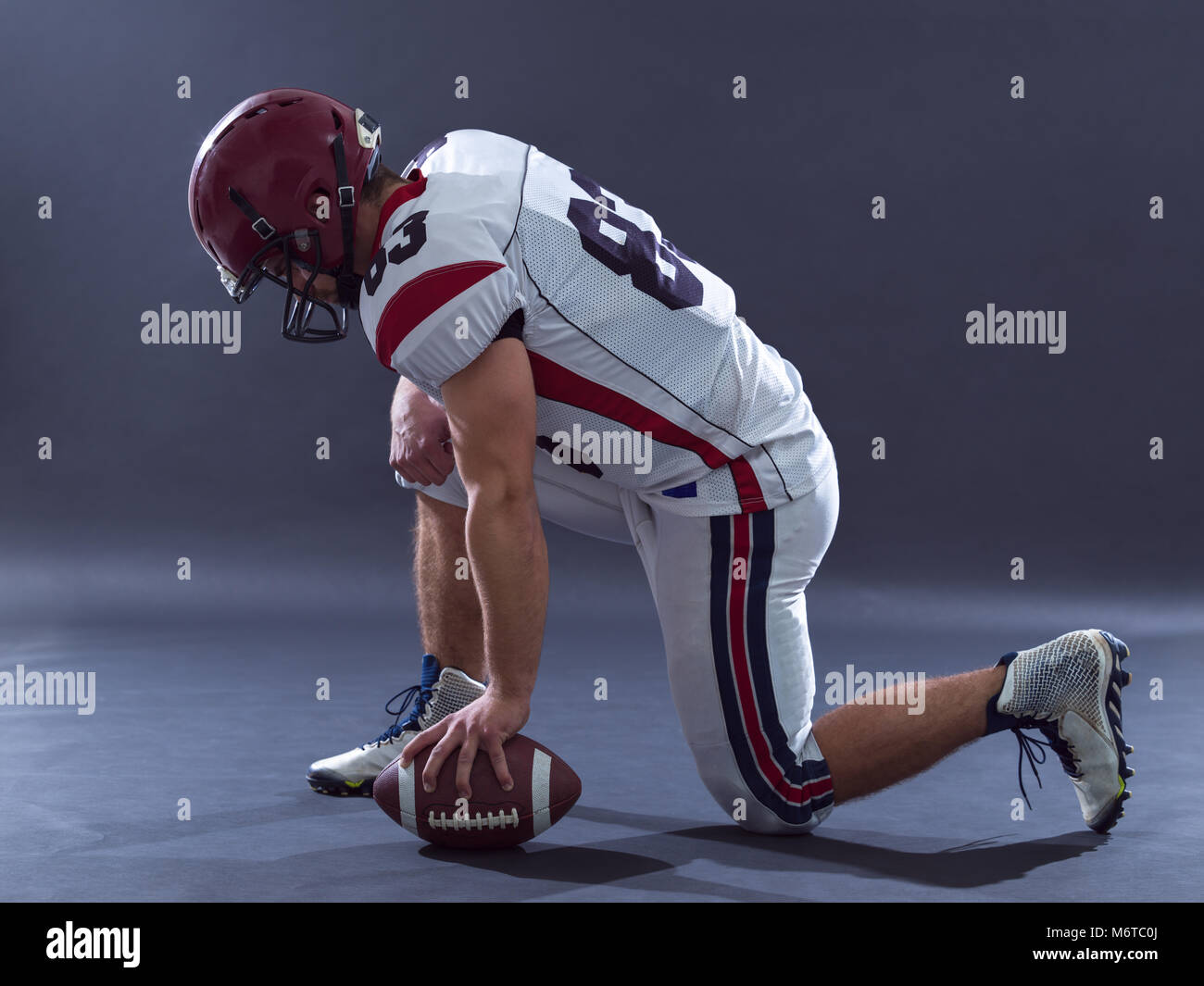 American football player getting ready before starting the game while ...