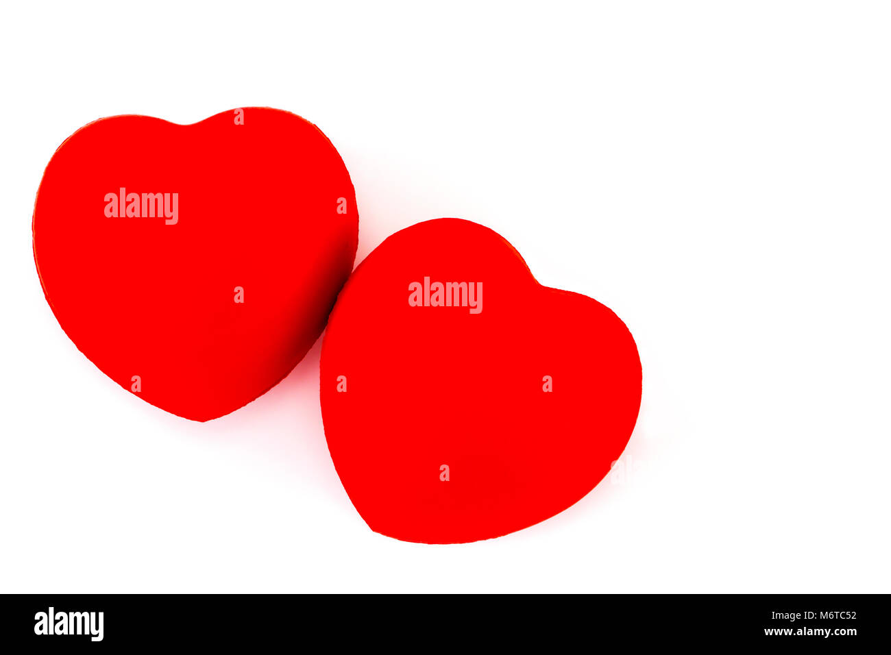 A two red heart isolated on white background Stock Photo - Alamy