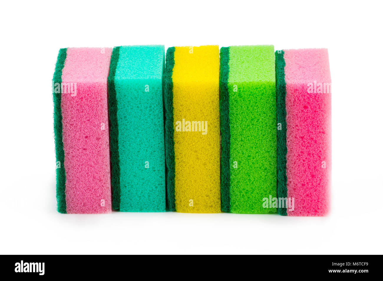 Stacked colored sponges isolated on white background Stock Photo - Alamy