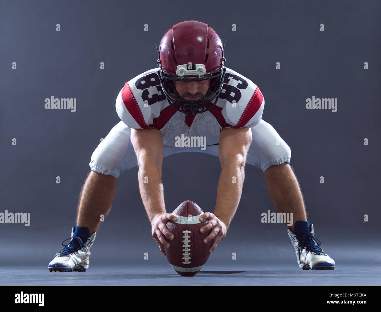 American football player getting ready before starting the game while ...