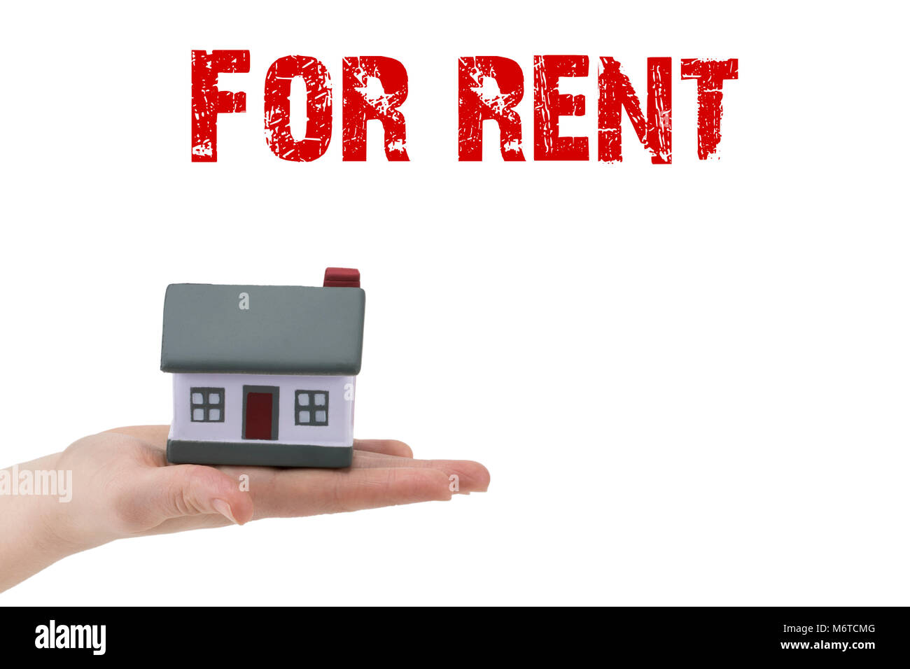 Miniature model of house with text:for rent Stock Photo - Alamy