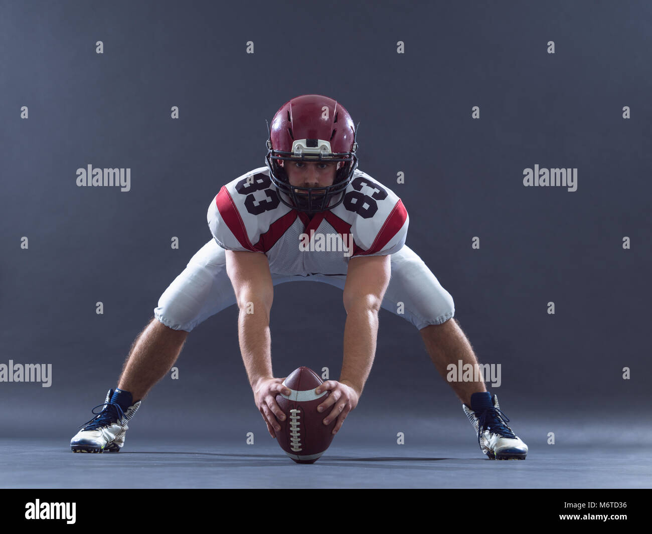 American football player getting ready before starting the game while ...