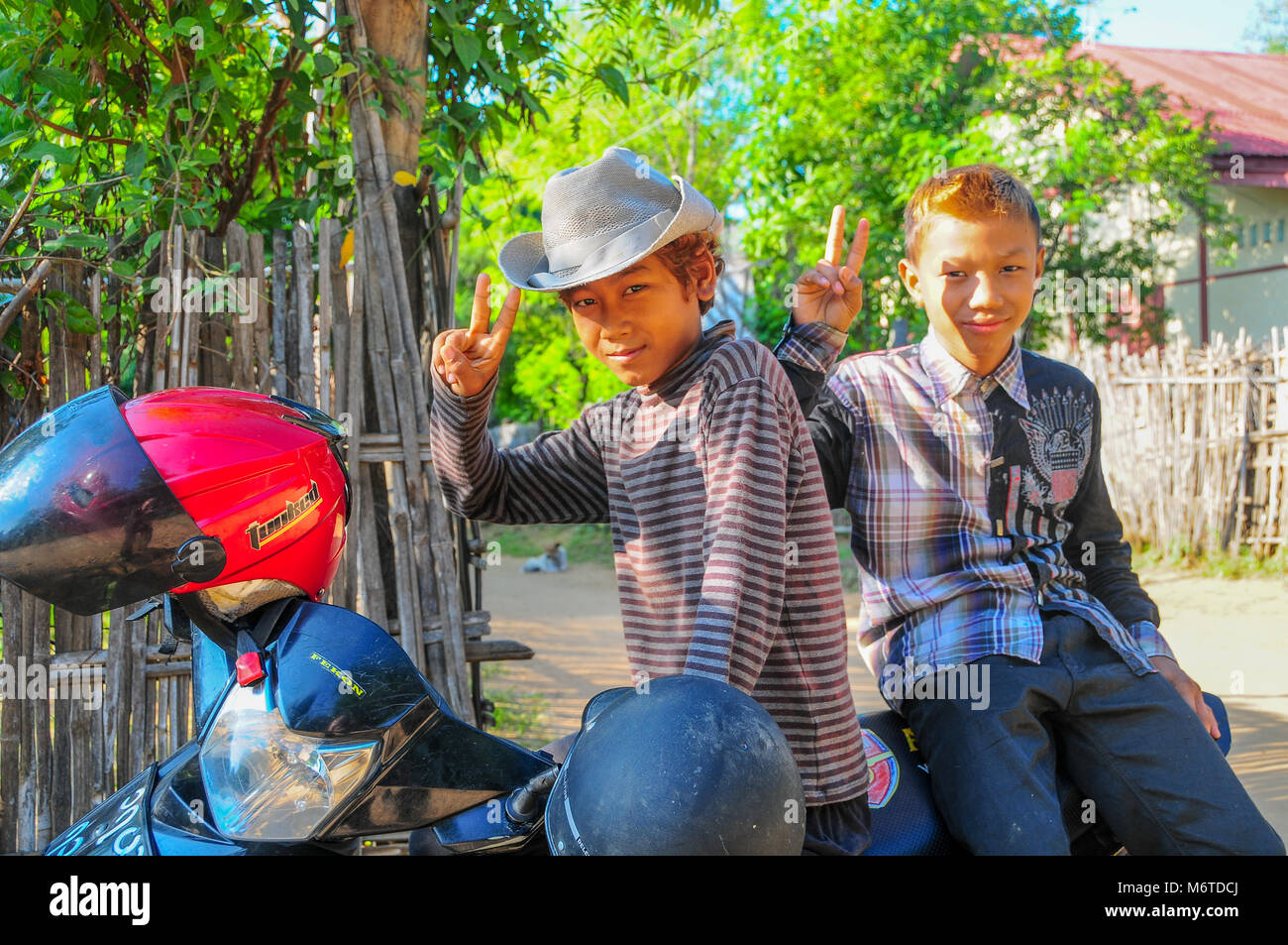 Mandalay, Myanmar - November 19 2014. Cool Burmese kids on motorbike ...