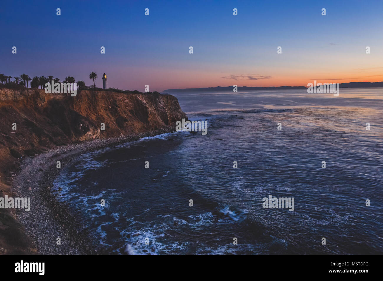 Beautiful coastal view of Point Vicente Lighthouse atop the steep cliffs of Rancho Palos Verdes ...