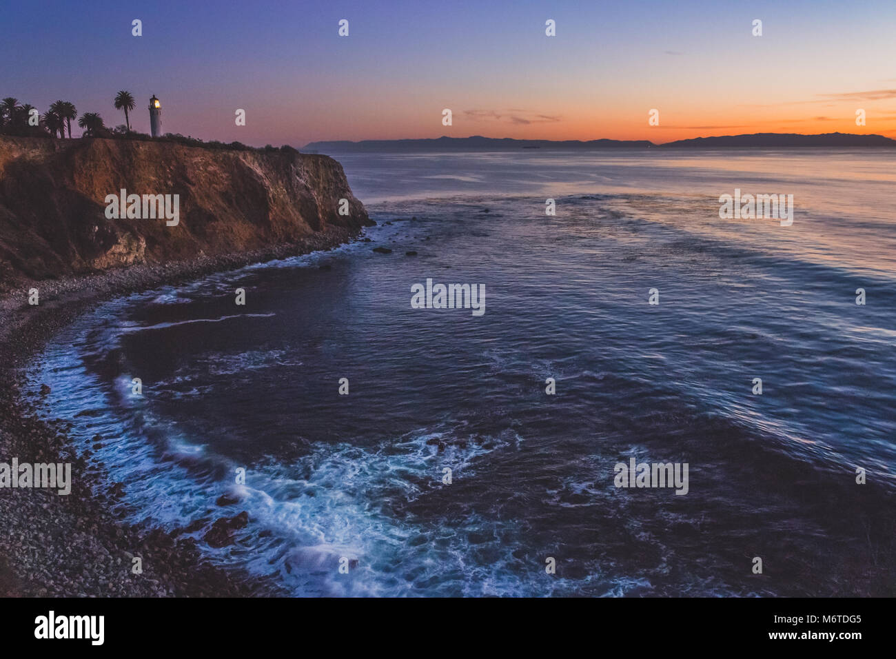 Beautiful coastal view of Point Vicente Lighthouse atop the steep cliffs of Rancho Palos Verdes ...