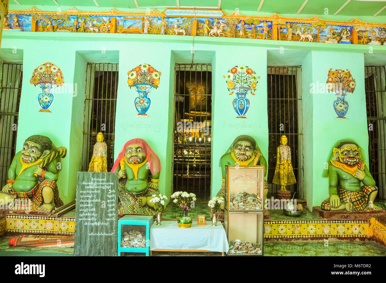 Monywa, Myanmar - November 19 2014. Ogres guarding Buddha image at Po ...