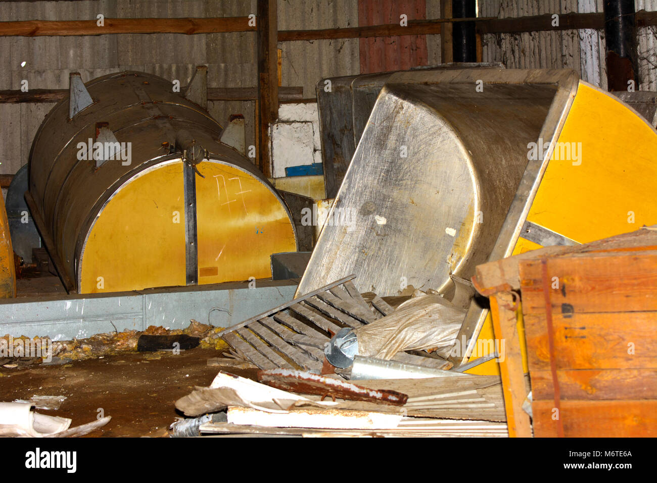 Old and rusty large capacity for cheese production in an abandoned and ...
