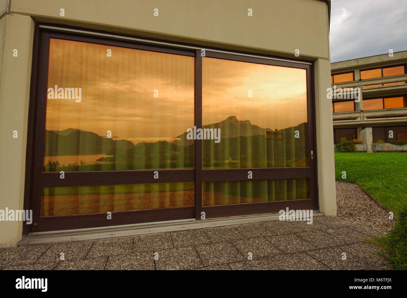 big house window with mountain reflection Stock Photo - Alamy