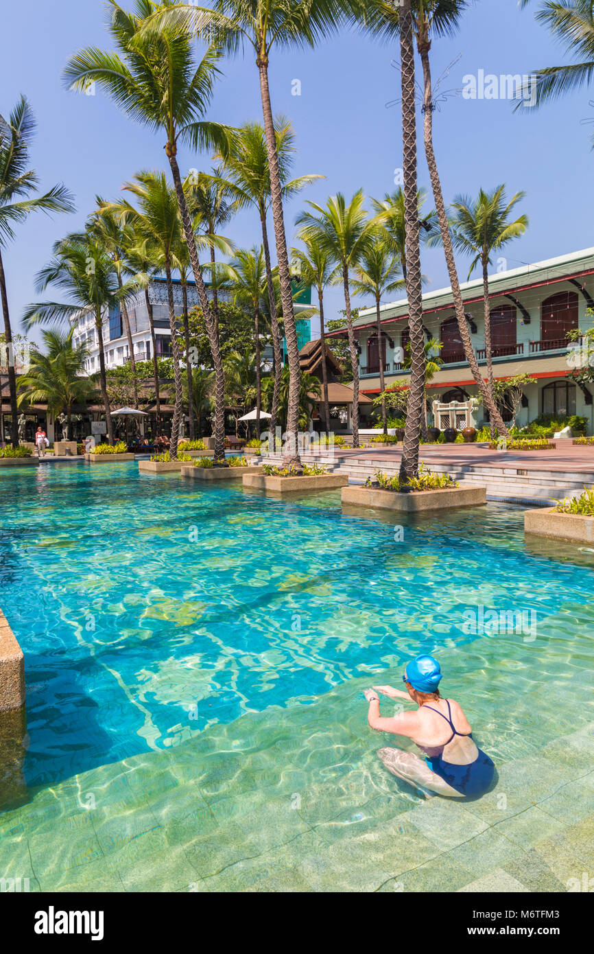 Outdoor pool surrounded by palm trees at Chatrium Hotel, Royal Lake ...