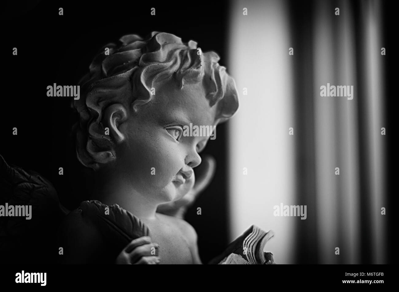 angel with book Stock Photo - Alamy