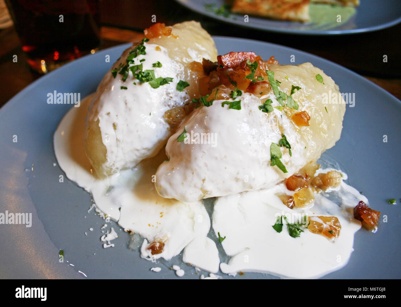 Cepelinai, traditional Lithuanian dish of stuffed potato dumplings ...