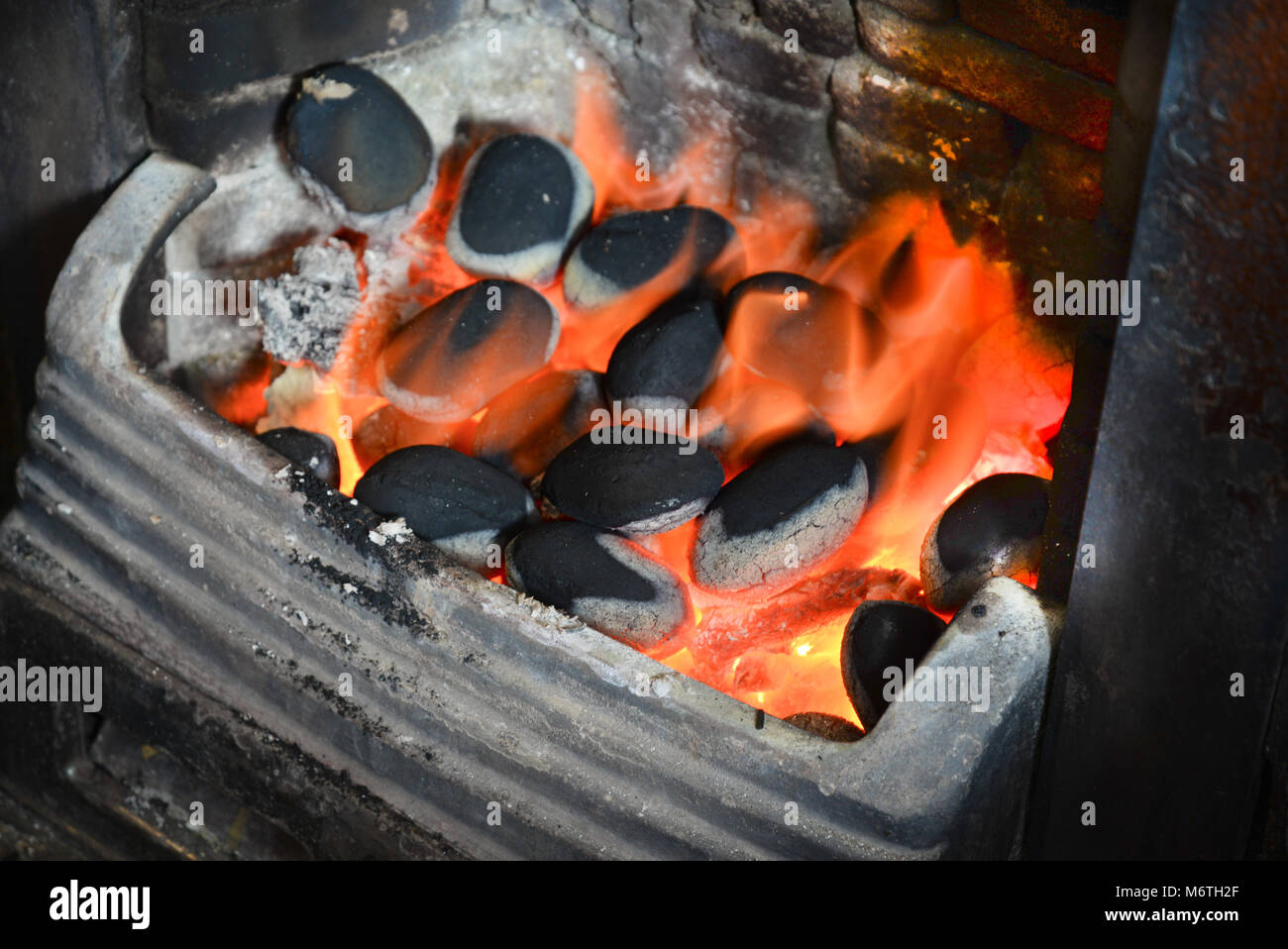 Open fire fuelled by coal oviods Stock Photo - Alamy