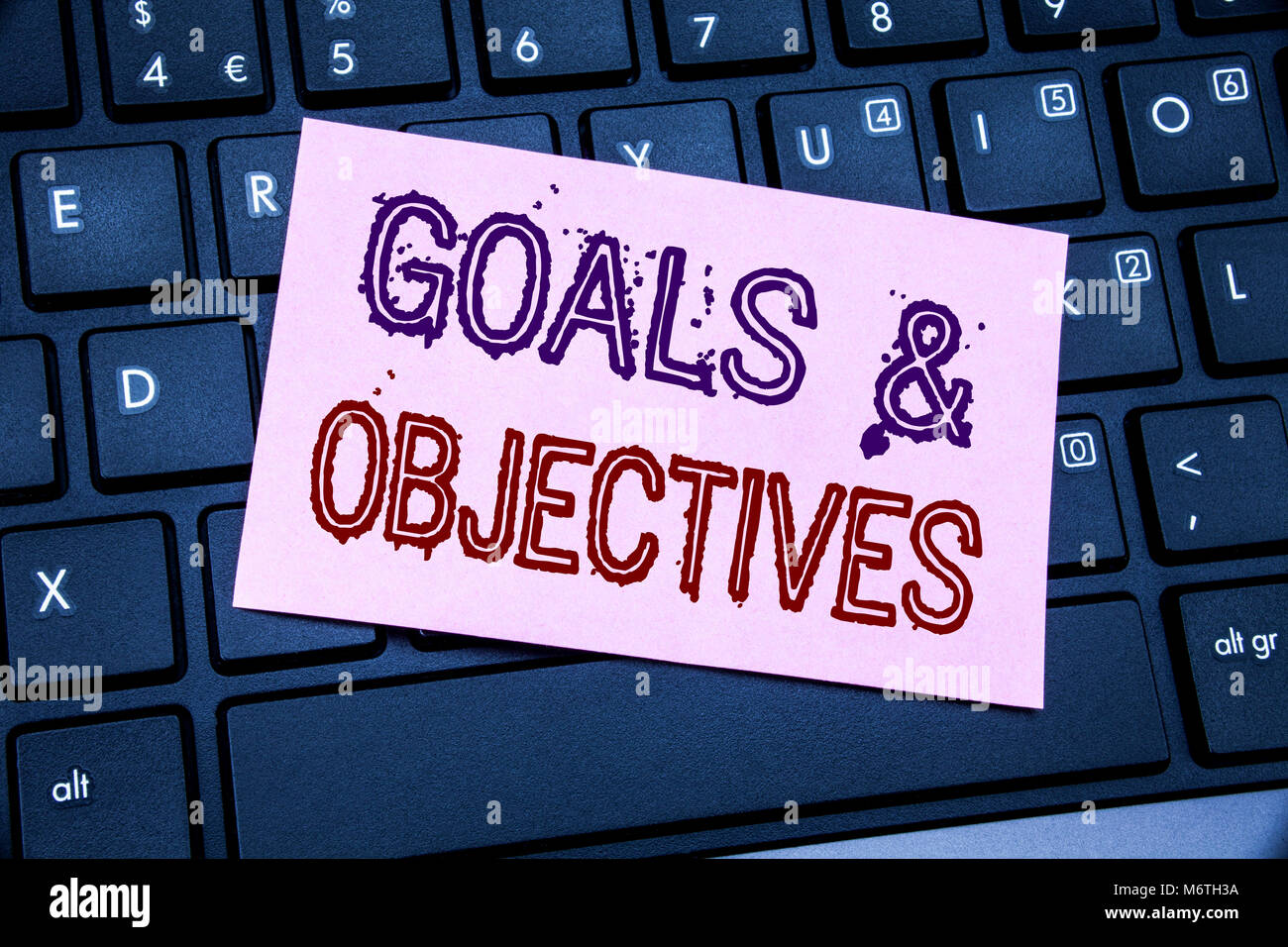 Handwriting Announcement text showing Goals Objectives. Business ...