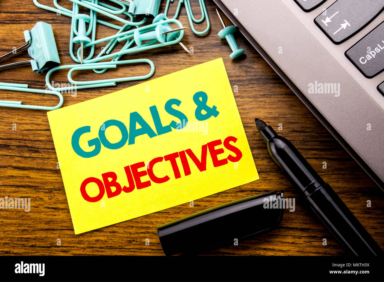 Handwriting Announcement text showing Goals Objectives. Business ...