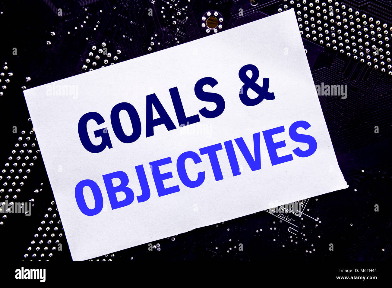 Handwritten text showing Goals Objectives. Business concept for Plan ...