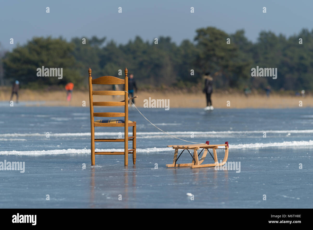 Wooden chair and sleigh on the ice as a resting point Stock Photo - Alamy