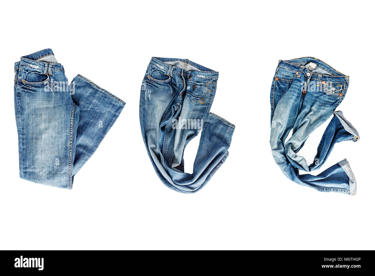 Collection of folded jeans isolated on white background Stock Photo - Alamy