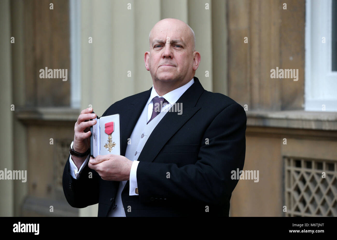 Dr John Godber with his OBE medal following an investiture ceremony at ...