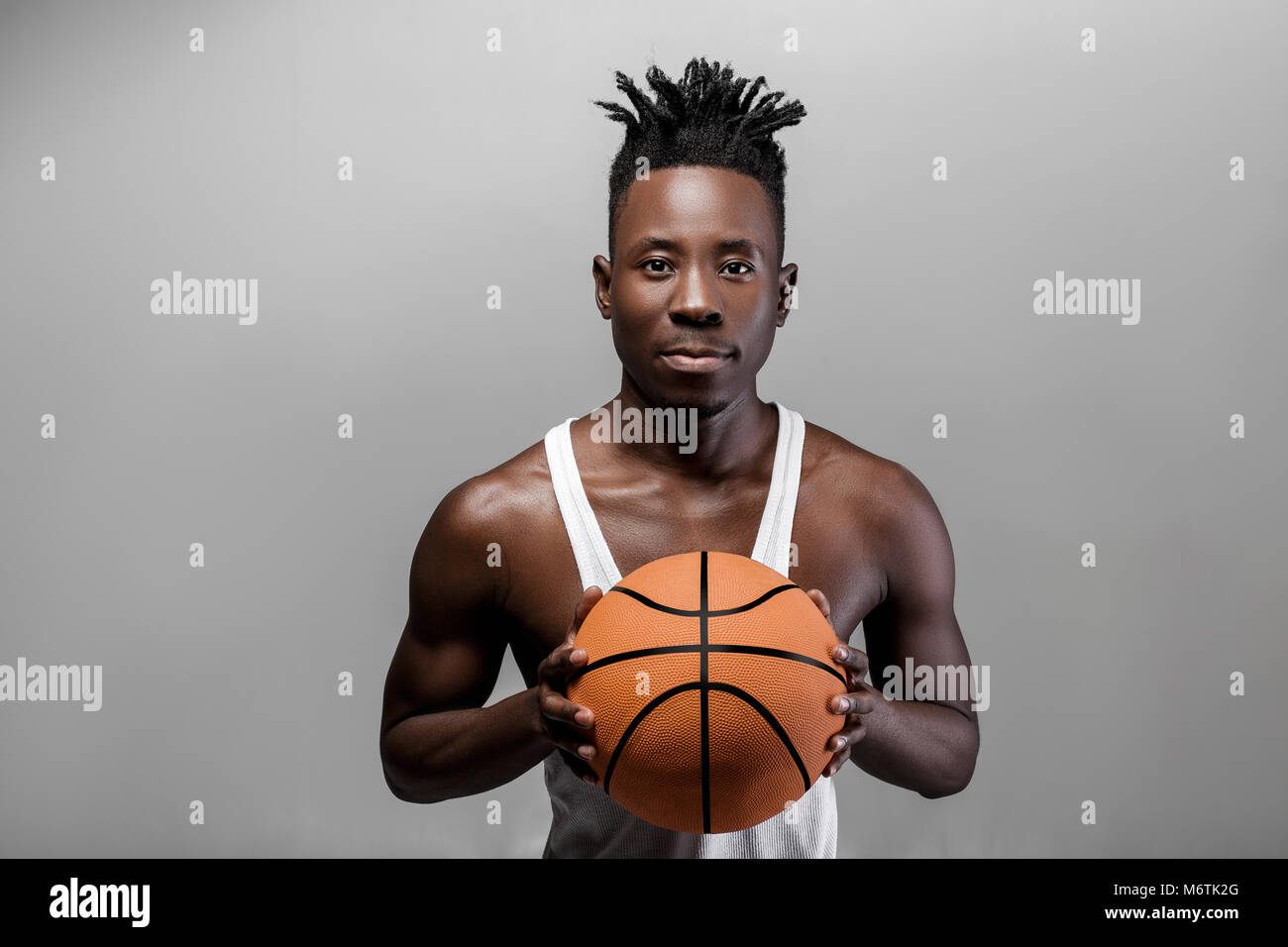 African-American man with basketball Stock Photo - Alamy