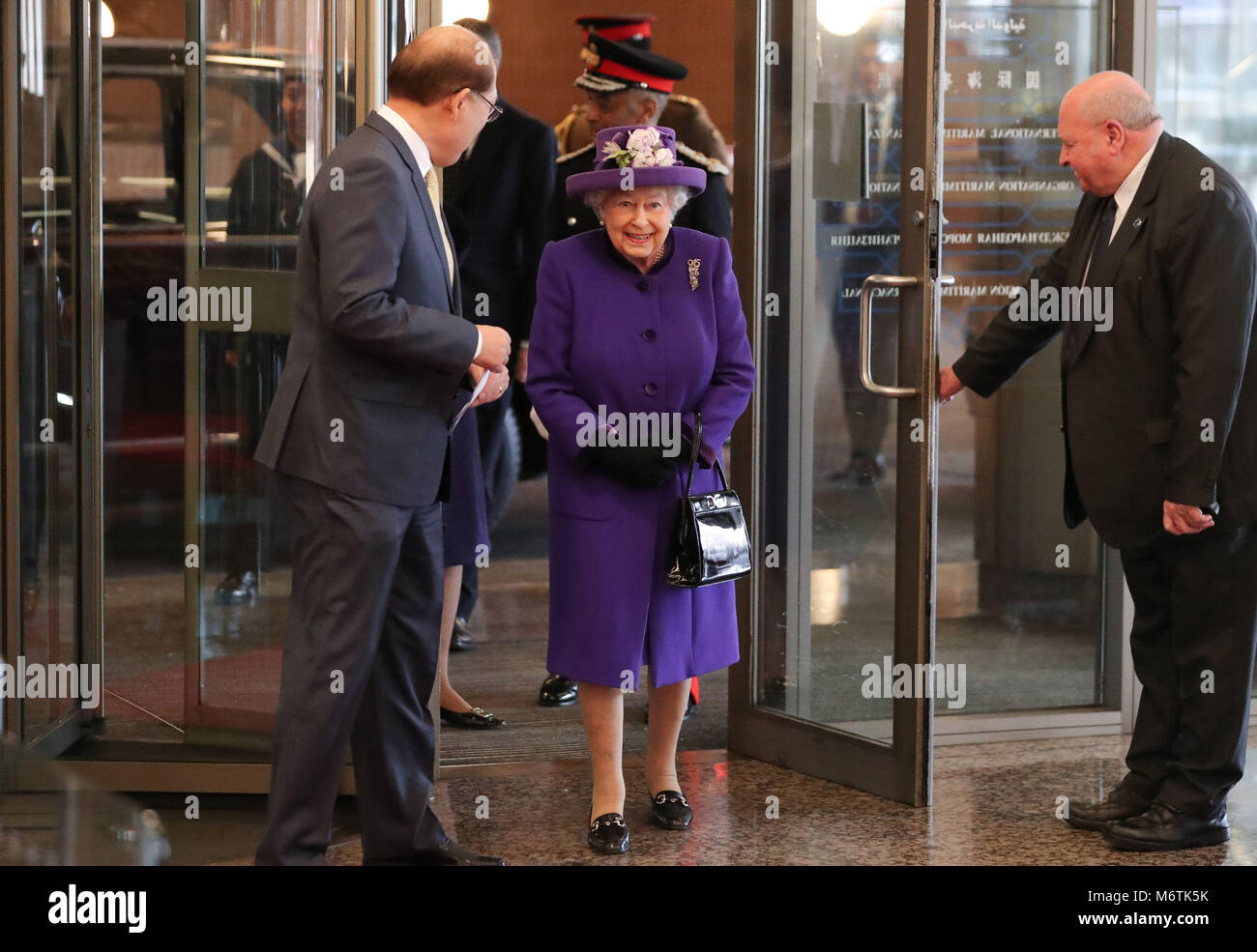 Queen Elizabeth II is greeted by Secretary-General of the International ...