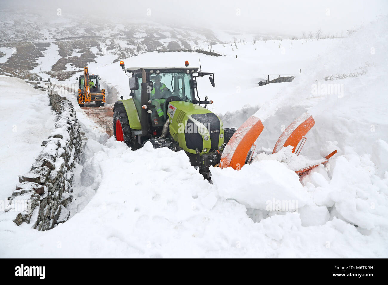 A snow blower in Nenthead, Cumbria clears the roads Stock Photo - Alamy