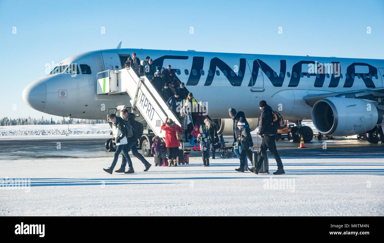 Passengers disembark from a FinnAir flight in Kittila in Finland Stock ...