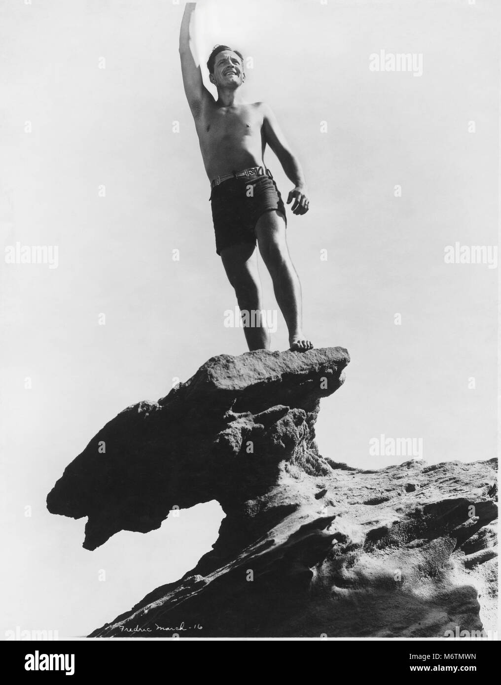 Actor Fredric March Standing on Rock Formation in Bathing Suit, Low ...