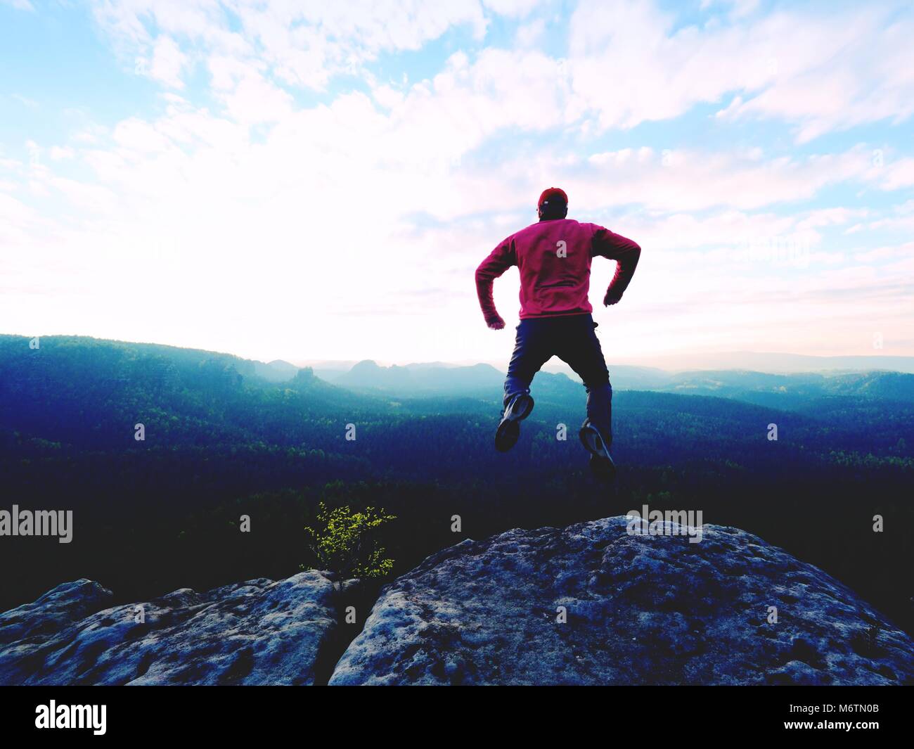 Man dangerously jumping on the edge. Man jump. Young man falling down ...