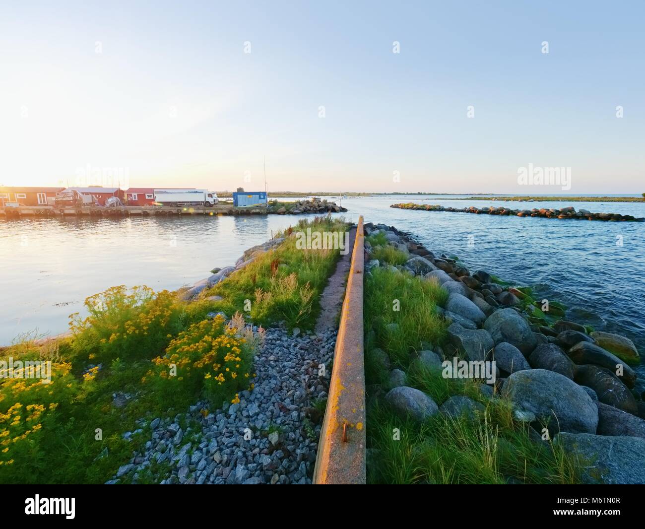 Small fishing port with boats anchored and moored on sea bay in Sweden ...
