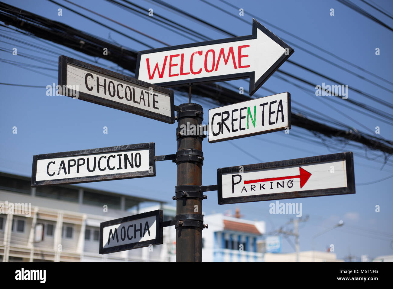 The way of drink fro wooden sign arrow in cafe Stock Photo - Alamy