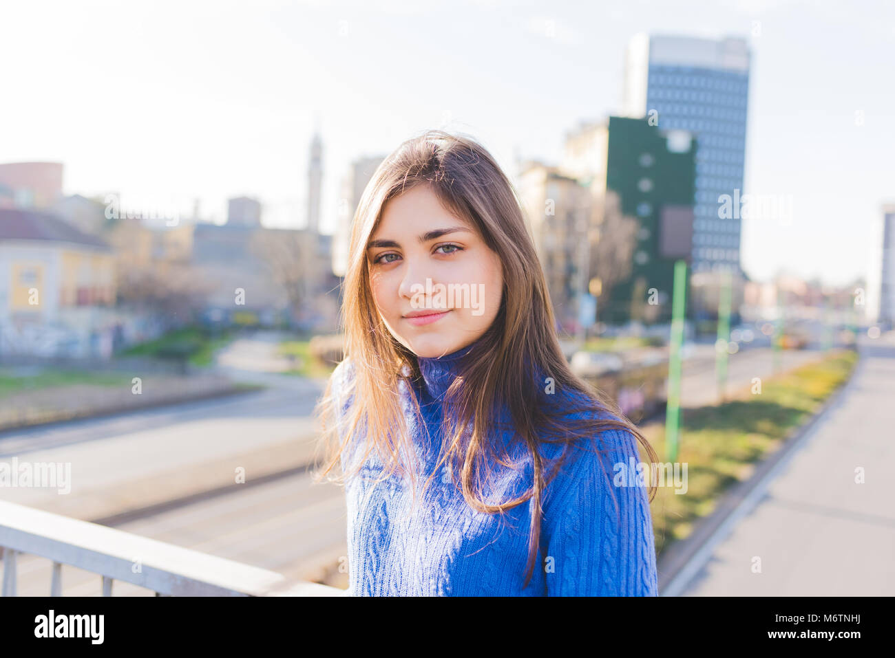 Portrait Young Woman Outdoor Back Light Looking Camera Smiling