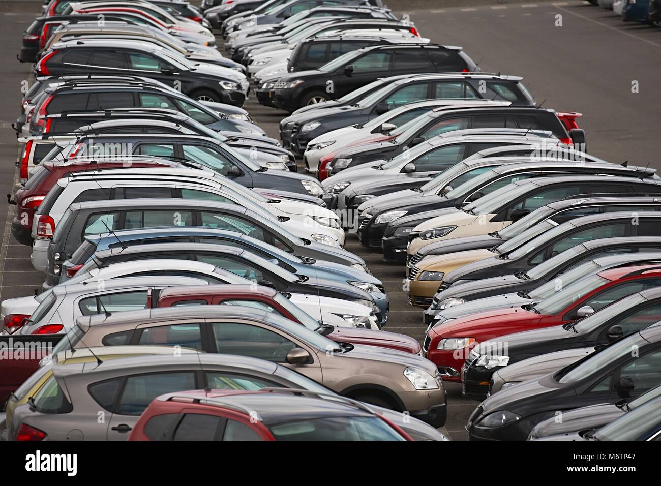 Cars Parked in a row Stock Photo - Alamy