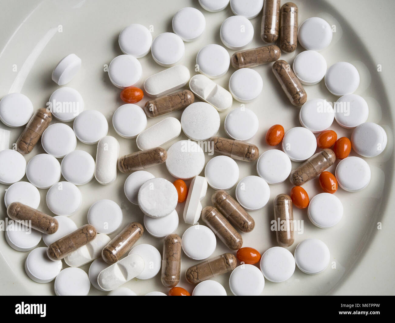 Blue pill on plate hi-res stock photography and images - Alamy